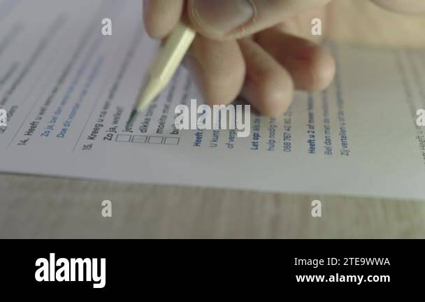 Hand with a pencil ticks checkbox marks filling up to do list. Check ...