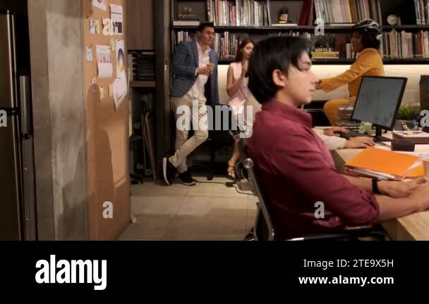 Casual female staff worker use the bicycle to go home after work ...
