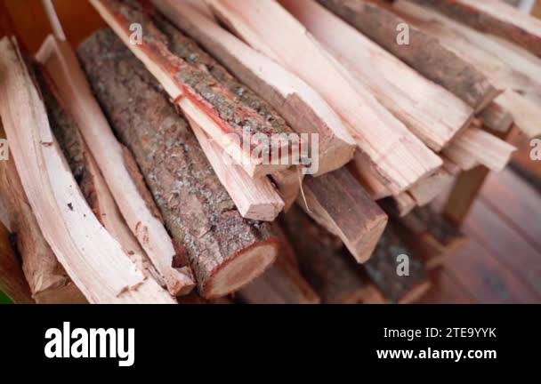 Firewood for lighting a fire for a fireplace and barbecue lies neatly ...