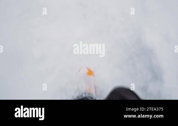 Kicking snow with feet top view. 4K footage slow motion. Snowy winter ...