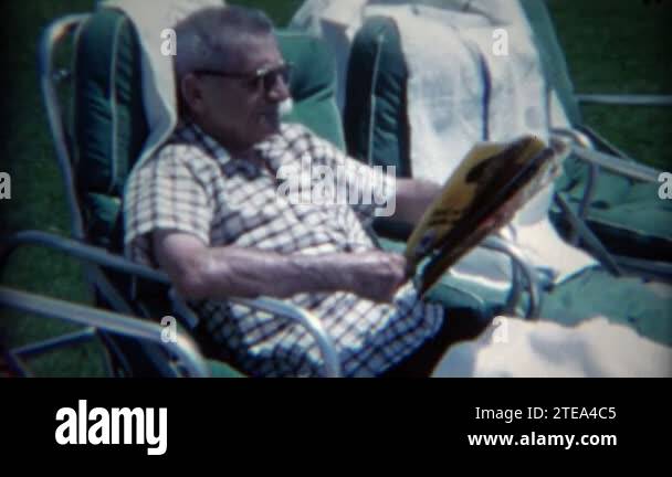 Poolside reading Stock Videos & Footage - HD and 4K Video Clips - Alamy