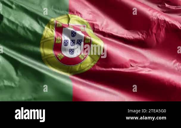 Portugal textile flag waving on the wind loop. Portuguese banner ...
