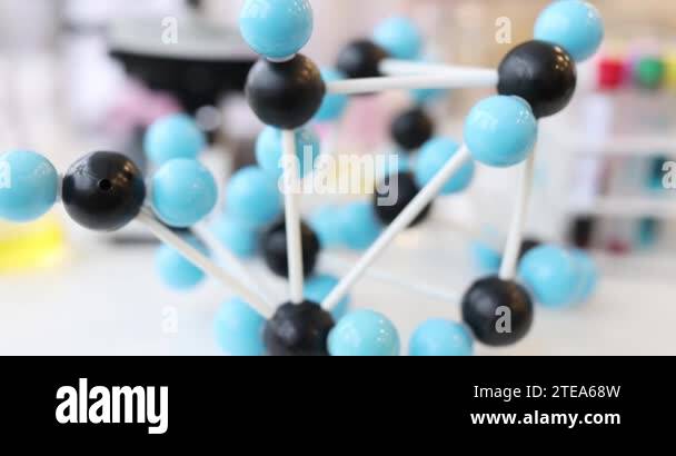 Mockup of tube with molecular structure and test tubes in laboratory ...