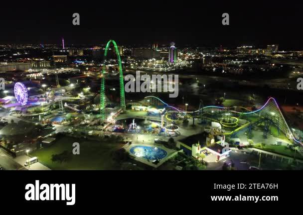 Night scape landscape of illuminated attraction at amusement park at ...