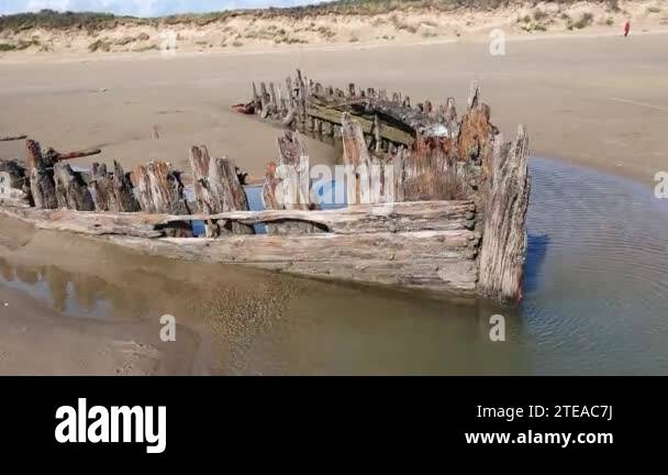 Shipwreck on the Cefn Sands beach at Pembrey Country Park in ...