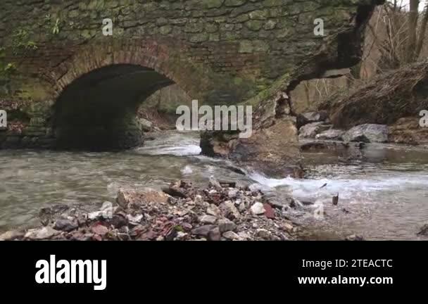 Damaged bridge shows broken bridge after heavy rainfall and extreme ...