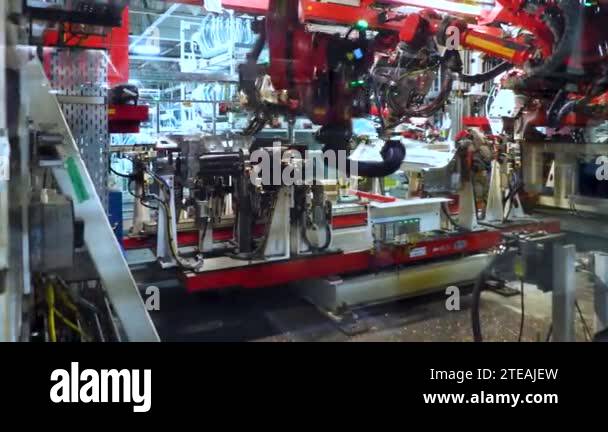 Robotic machine, red robotic arm. Automated plant, conveyor line ...
