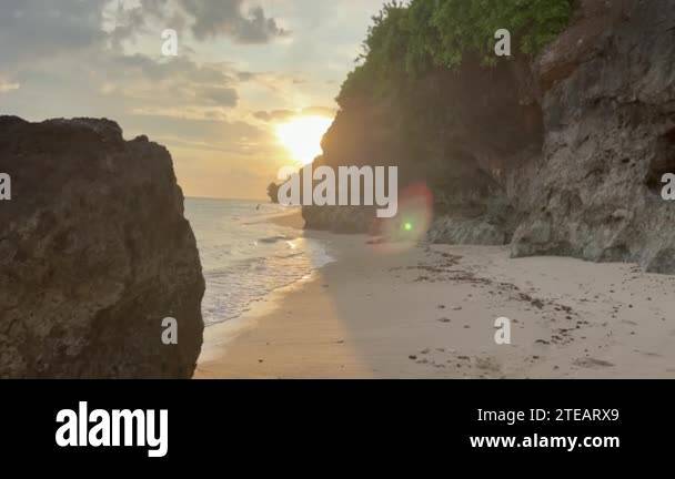 POV view live camera footage of walk along ocean shore with white sand ...