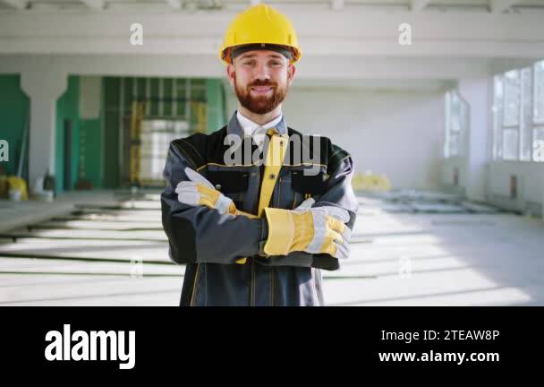 Charismatic construction worker man at construction site wearing ...
