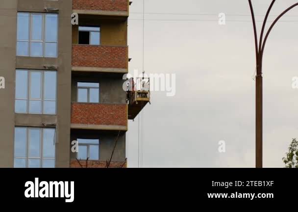 During the construction of a multi-storey building, builders perform ...
