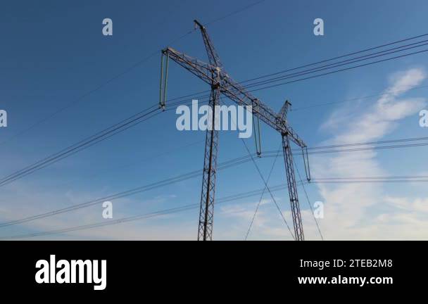High voltage tower with electric power lines transfening electrical ...