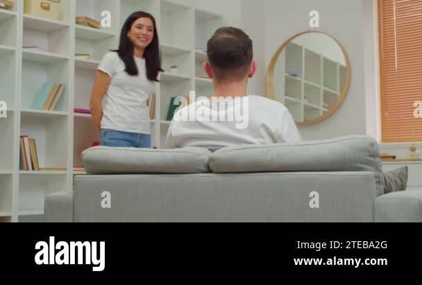 Little girl with the help of mother pulling a prank of her dad on April ...