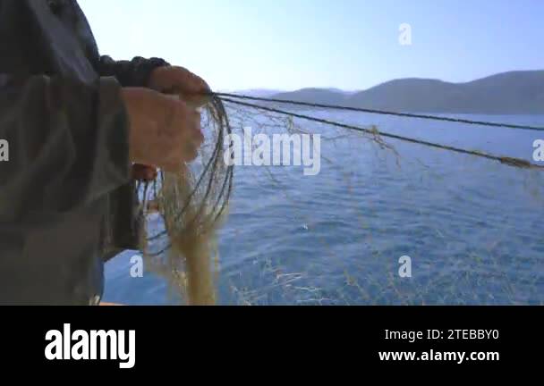 Fishing nets gather on the boat.A fisherman collects nets.Nylon net ...