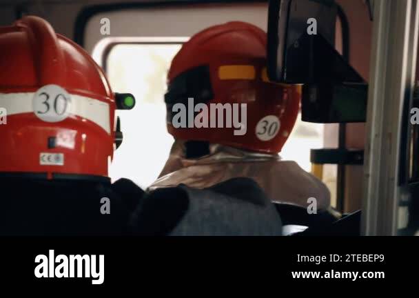 Close up portrait of strong serious firemen in helmet. Concept of ...