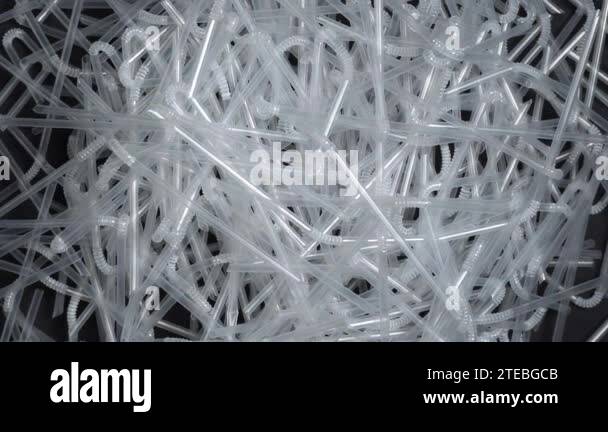 Plastic straw waste collection. Juice cocktail plastic straw slowly ...