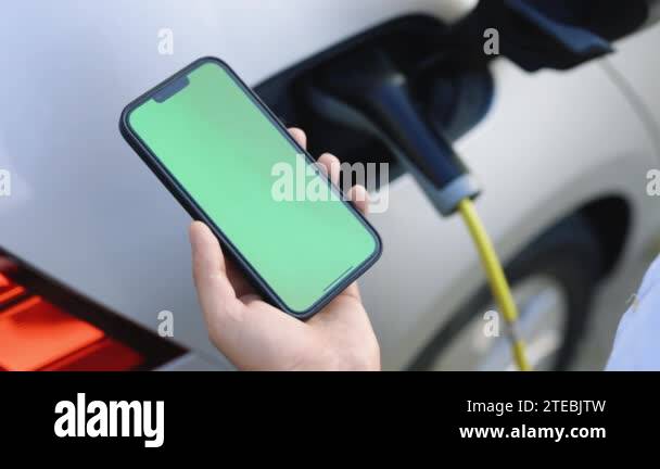 Green screen mock up chromakey display smart phone with electric car ...