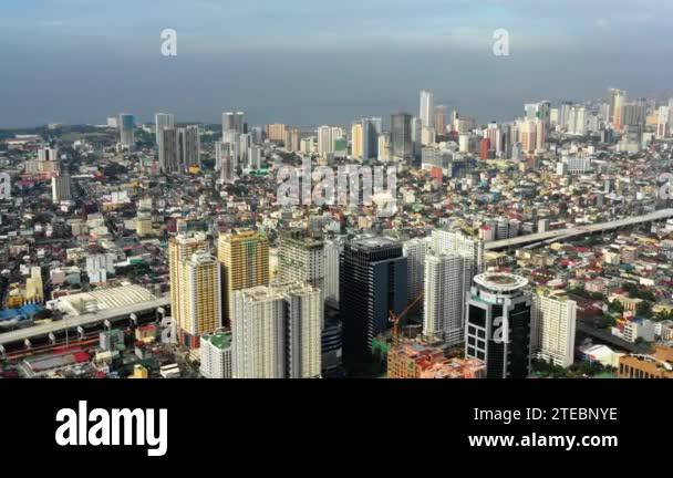 Manila skyline covered with pllution in daylight. The beautiful capital ...