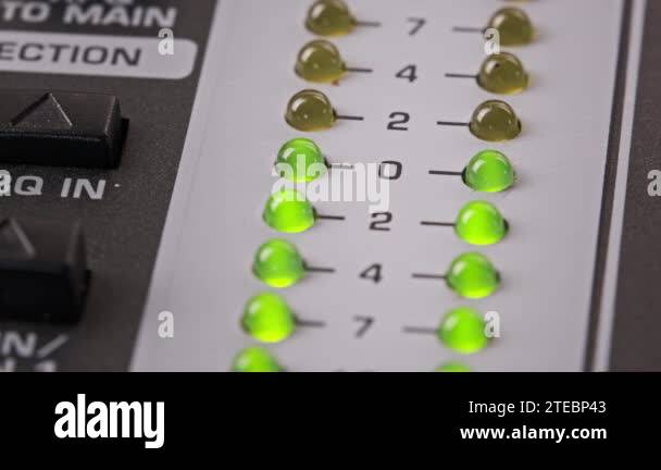 LED indicator of sound level signal on the mixing console. Close-up ...