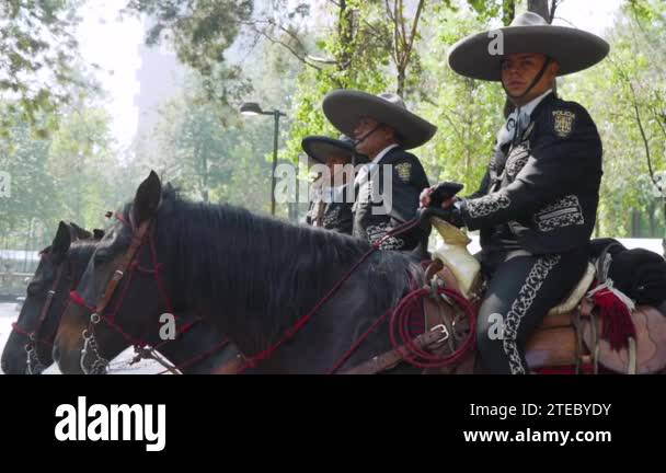 Mexican police officers patrol mounted on horseback in traditional ...