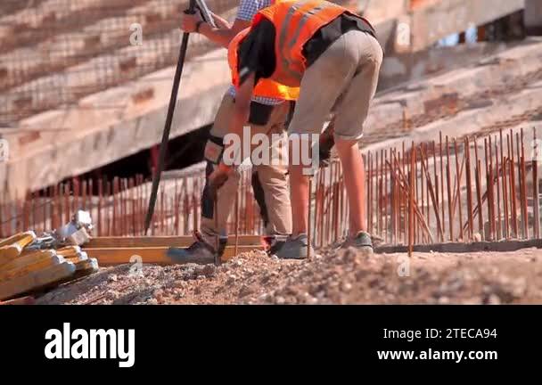 Building construction. Working process at a construction site. Builders ...