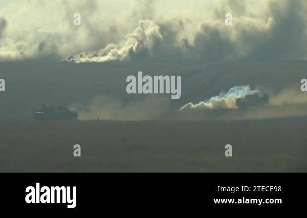 Infantry fighting vehicle on the battlefield in smoke. Military armored ...