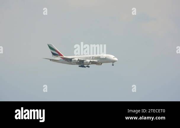 Emirates plane with landing gear opened preparing for landing at ...