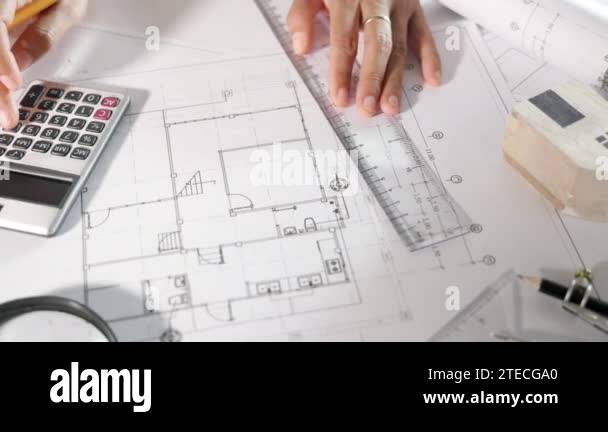 Architectural project workspace. Top view of architect drawing with ...