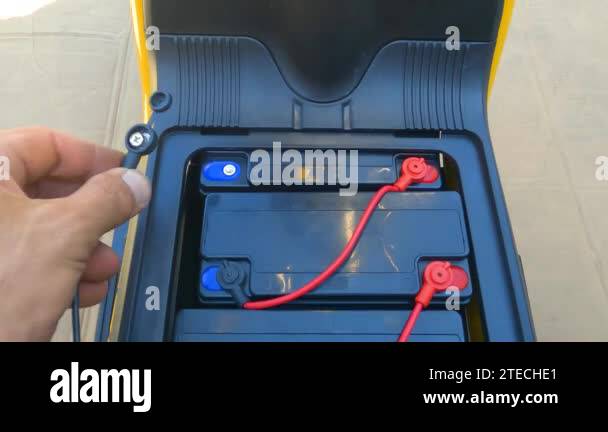Connecting the battery to the electric bike Stock Video Footage - Alamy