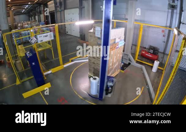 Packaging boxes with products in plastic film at the factory. A special ...