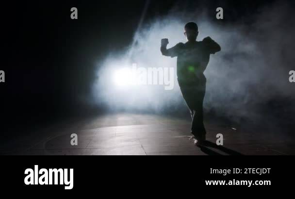 Teenage female dancer performing hip hop dance in slow motion with ...