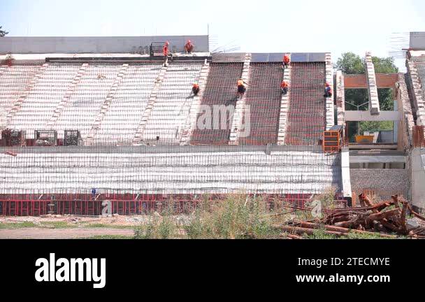 Working process at a construction site. Building construction. Builders ...