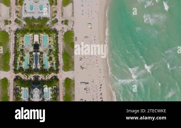 Top down footage of waves washing sand beach in tropical vacation ...