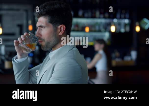 Leader person drinking whiskey in restaurant. Handsome thoughtful ...