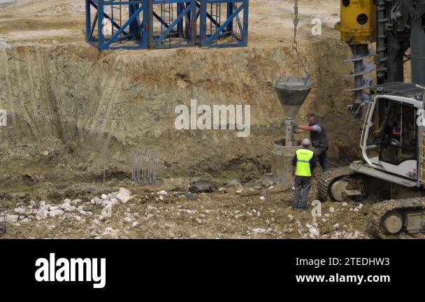 onstruction works - Installation of a conical funnel for concrete Stock ...