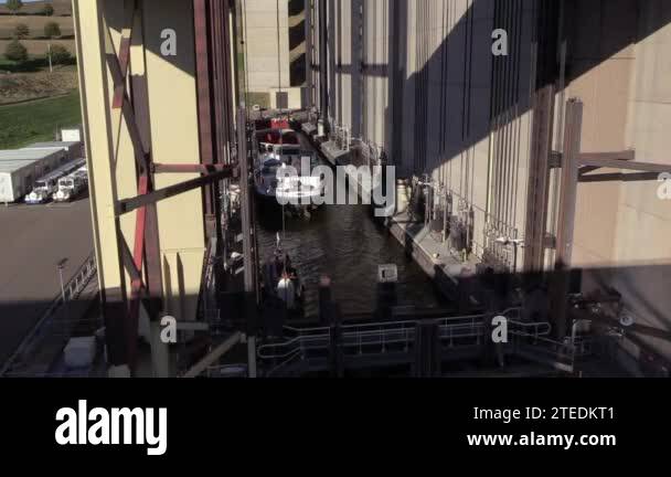 sluice lock closing the water container with a small boat and cargo ...