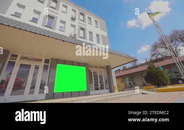 Advertising banner green screen. An office building with a green screen ...
