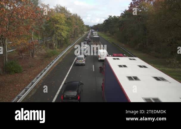 Long Lanes Of Vehicles Stucked In Heavy Traffic Jam In The Highway At ...