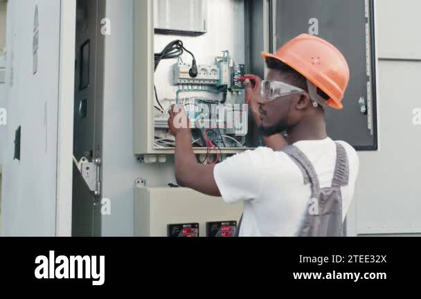 Electric Engineer Checking Power Voltage In Network Circuit Breaker. Electrical Systems ...