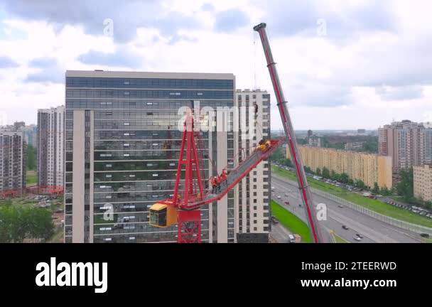 Installing the jib of a construction crane using another crane on the ...