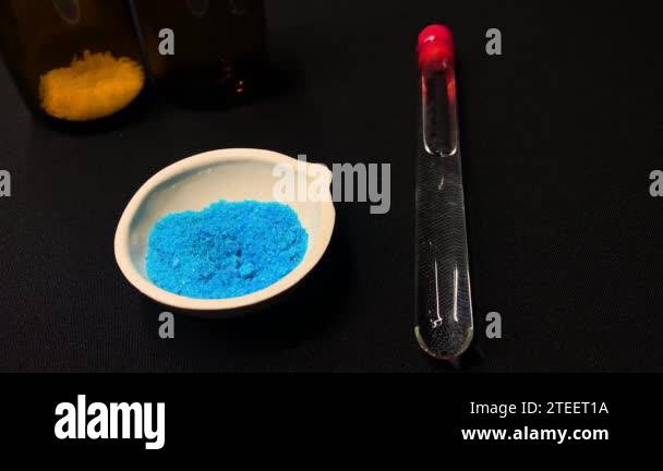 Lab footage, experiments with blue reagents, heating test tubes and ...