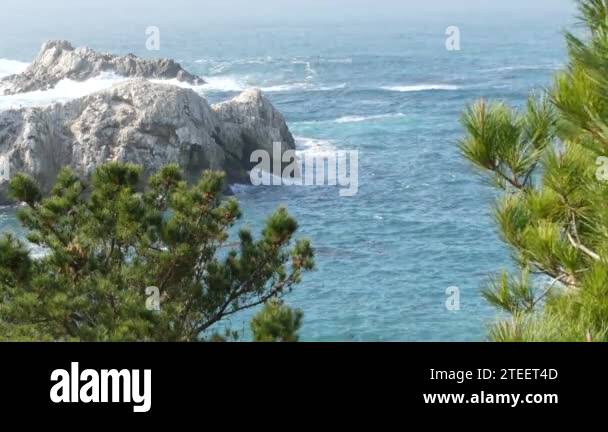 Rock, crag or cliff, waves crashing on ocean beach, water splashing ...