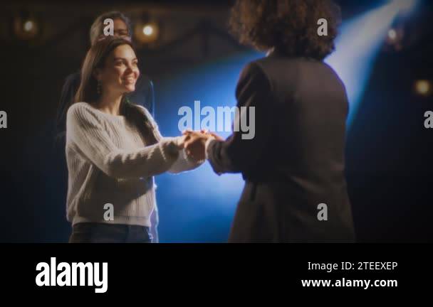 An actress and an actor rehearsing a love scene on a theater stage with ...