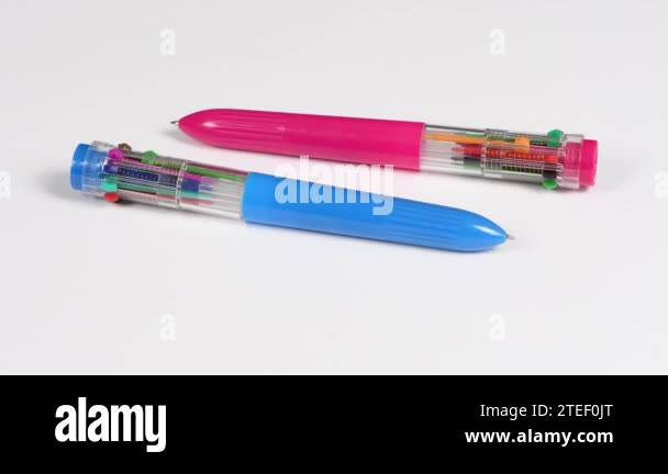 Two pens with colored refills on a white. Ten different colors. Side ...
