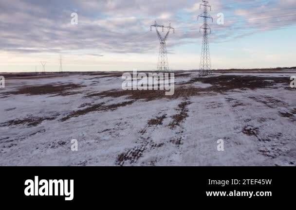 Low Aerial Flight of power lines and transmission towers on the Alberta ...