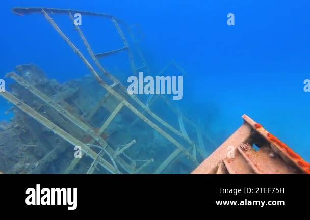 4K.Real old sunken ship wreck underwater at sea.Submerged boat in ocean ...