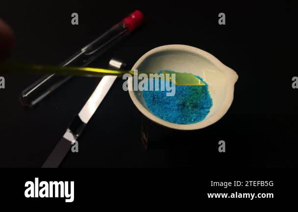 Lab footage, experiments with blue reagents, heating test tubes and ...