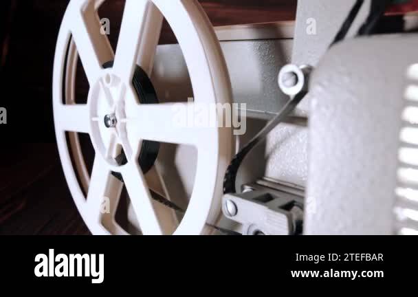 Footage of film reel turning. Analog player. Retro old-fashioned 8mm ...