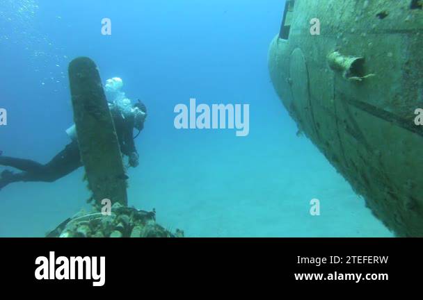 4K.Wreckage of sunken plane underwater the sea.Old historic warplane ...