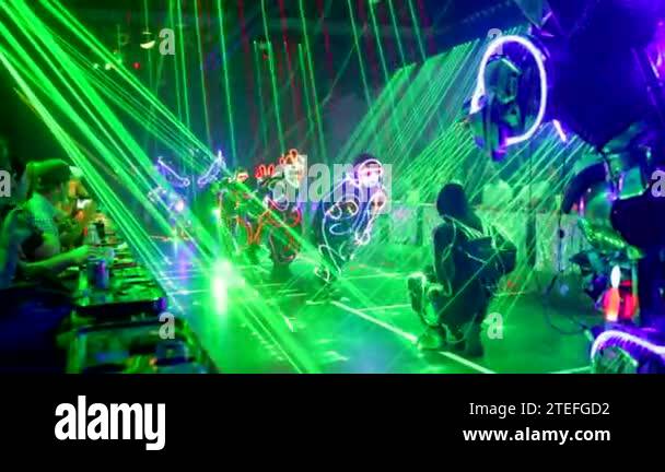 Dancers dancing live at a futuristic robotic laser light cabaret show ...