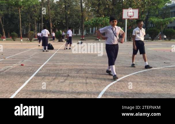 Unidentified students playing cricket at the Dhaka Residential Model ...